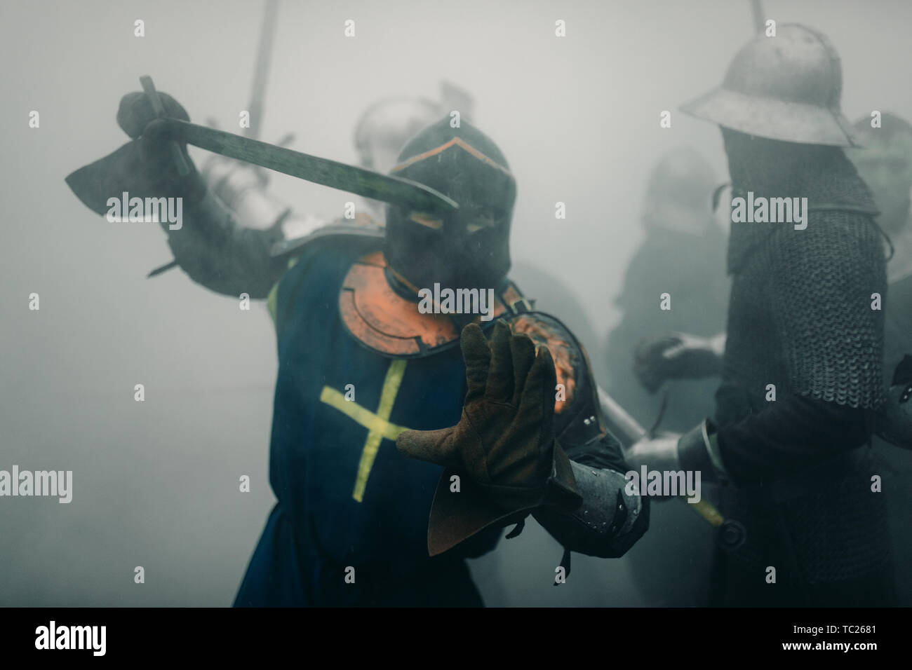 Combat squad of medieval knights of the Crusaders are in armors and ...