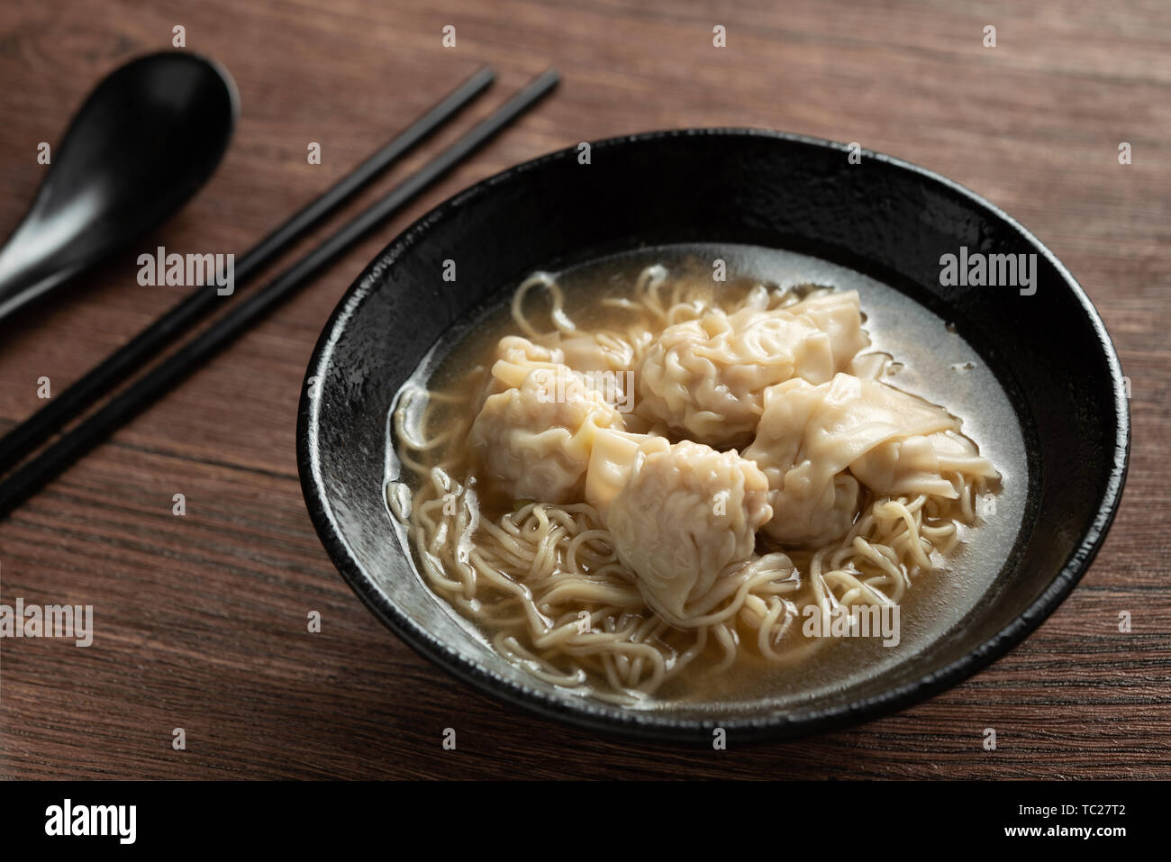 Cloud noodles on a wooden table top Stock Photo - Alamy