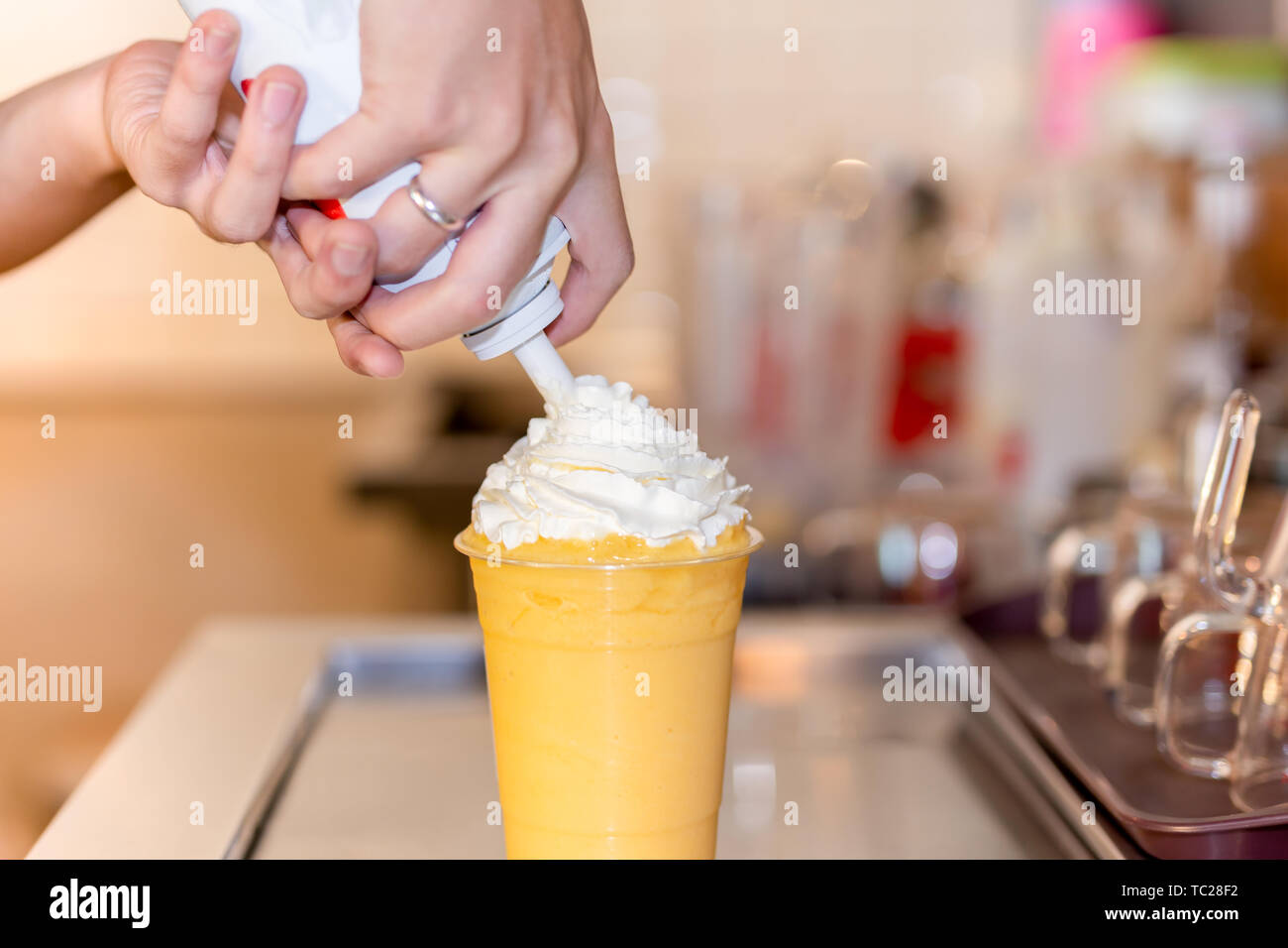 Hand squeezing bottle hi-res stock photography and images - Alamy
