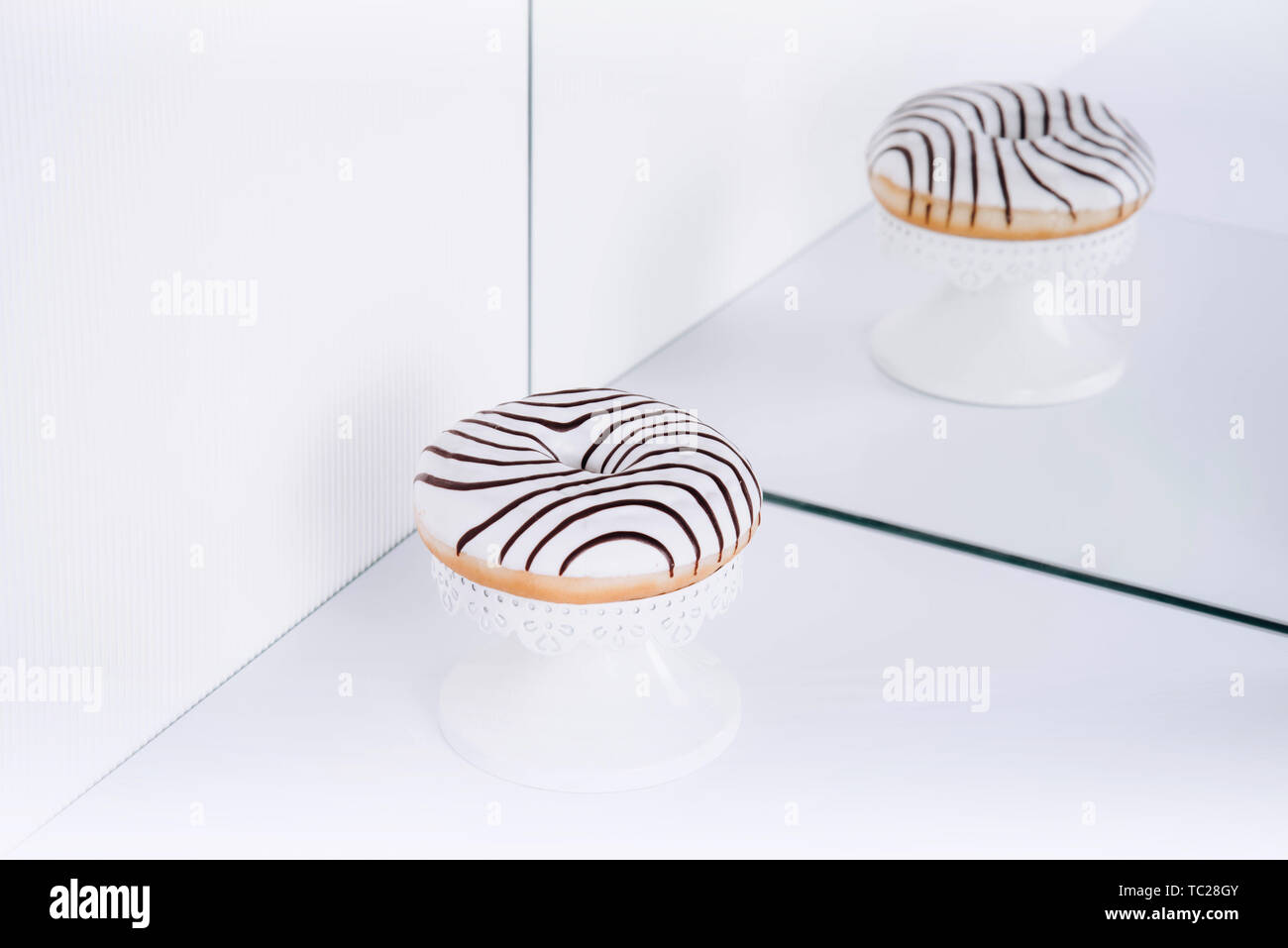 Striped donuts on a white background. Stylish minimal concept Stock ...
