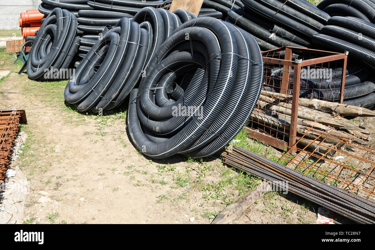 construction site with many corrugated pipes for laying fiber optics ...