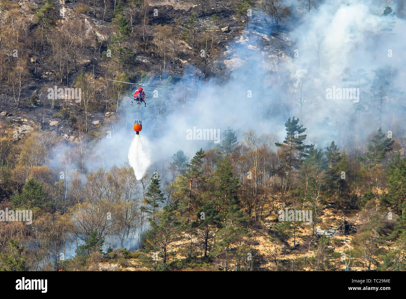 Helicopter extinguishing wildfire. Bergen, Norway Stock Photo - Alamy