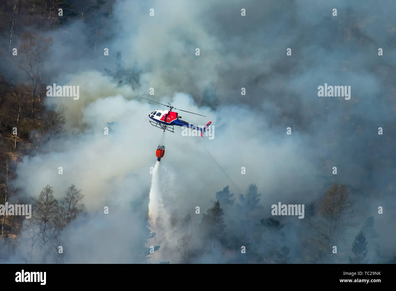 Helicopter extinguishing wildfire. Bergen, Norway Stock Photo - Alamy