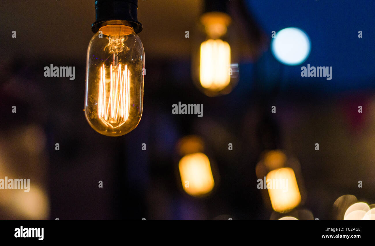 Hanging light bulbs at a street food market Stock Photo - Alamy