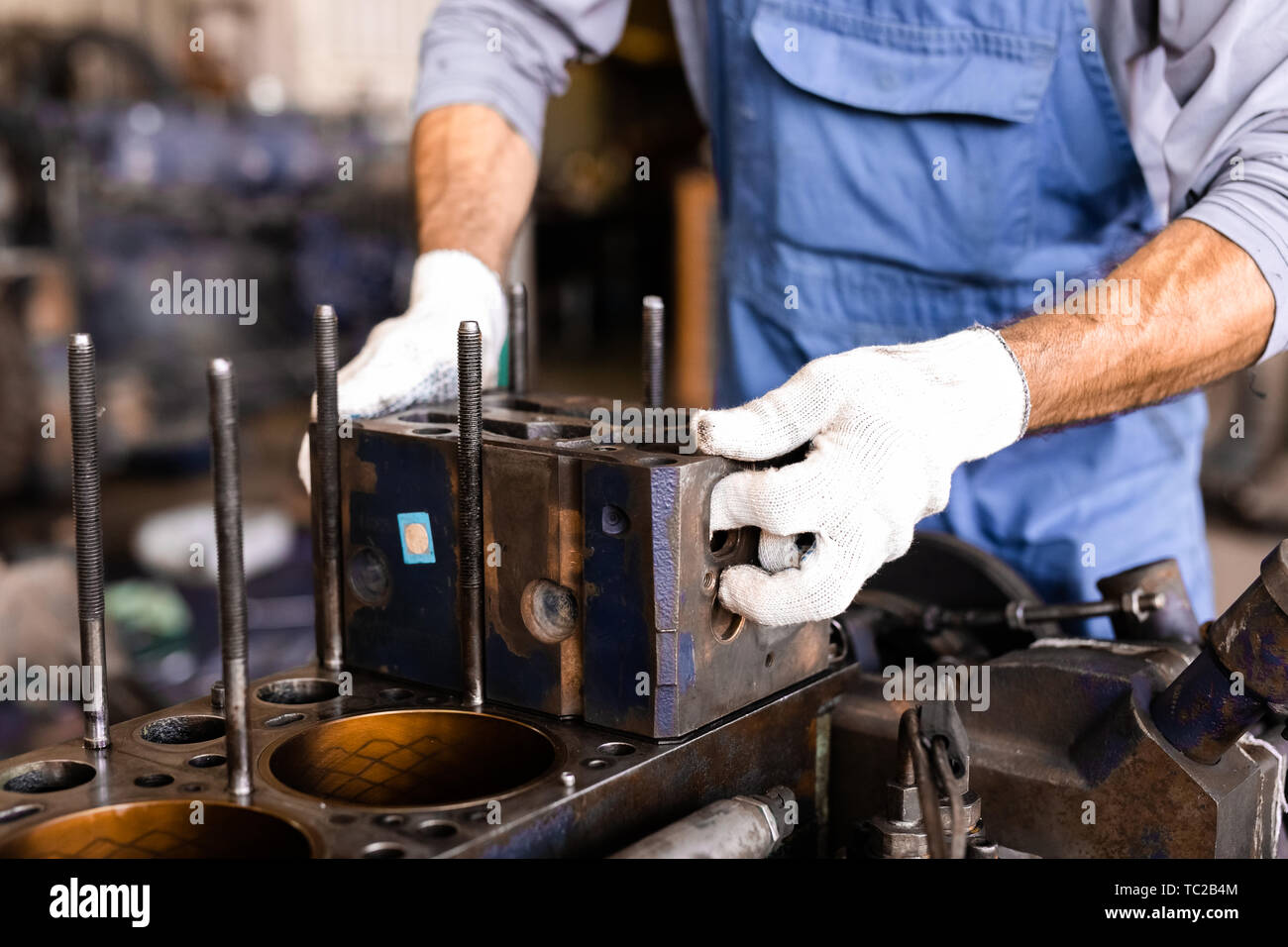 Mechanic opened the locking valve mechanism. Disassemble engine block ...