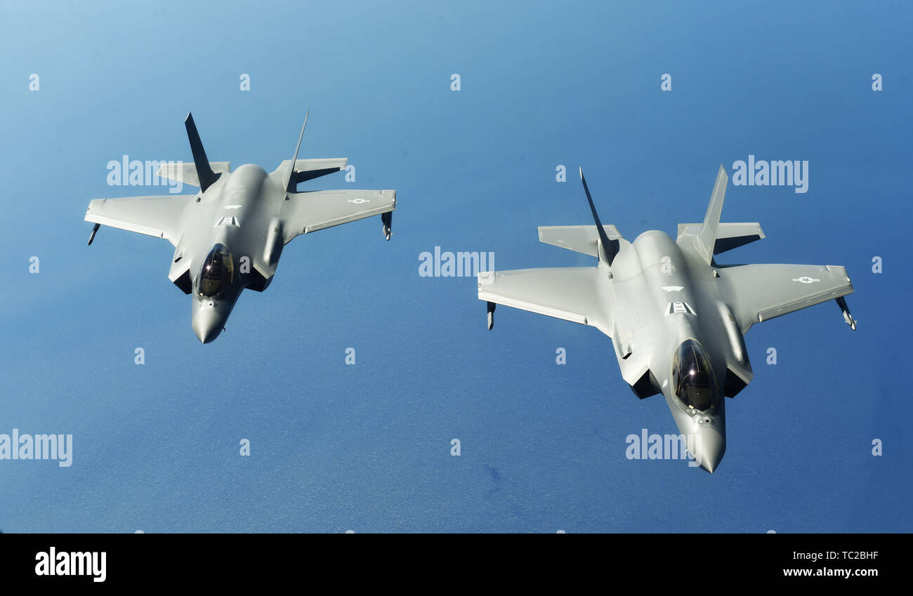 Two U.S. Air Force F-35 Lightning II stealth fighter aircraft fly in ...