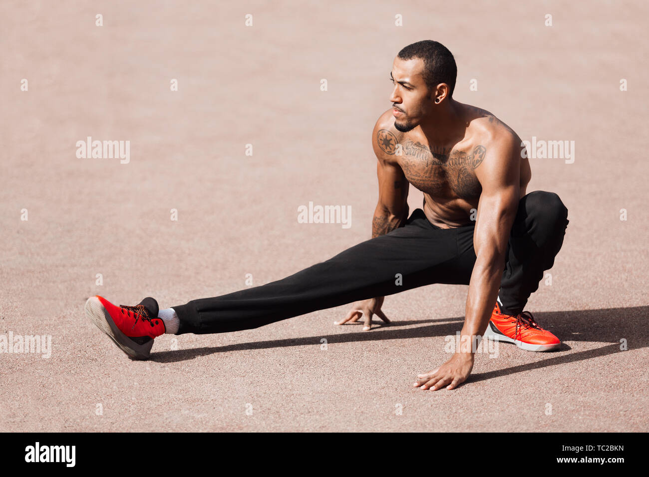 Muscular Man Stretching His Body After Training Stock Photo - Alamy