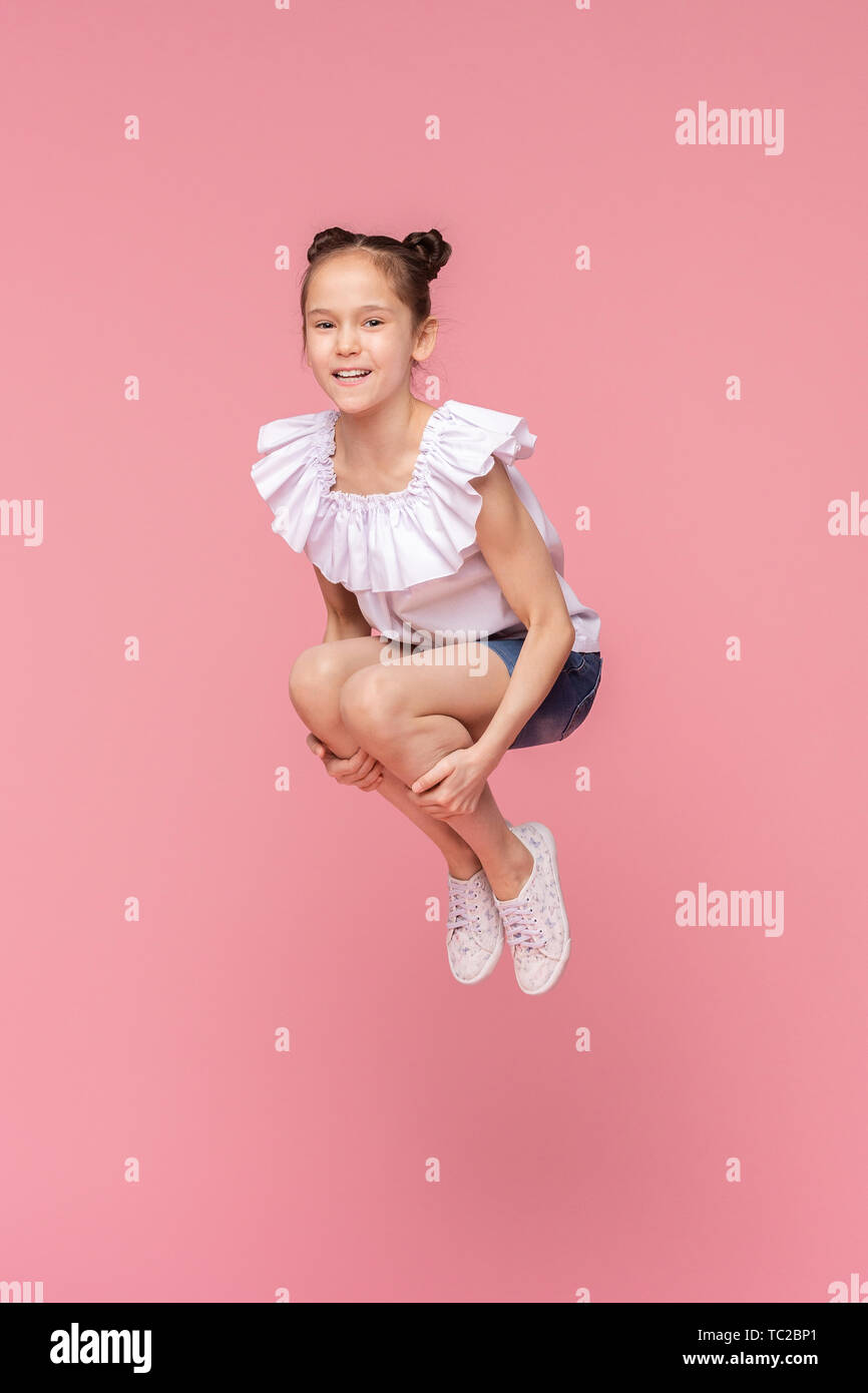 Happy child kid girl jumping hi-res stock photography and images - Alamy