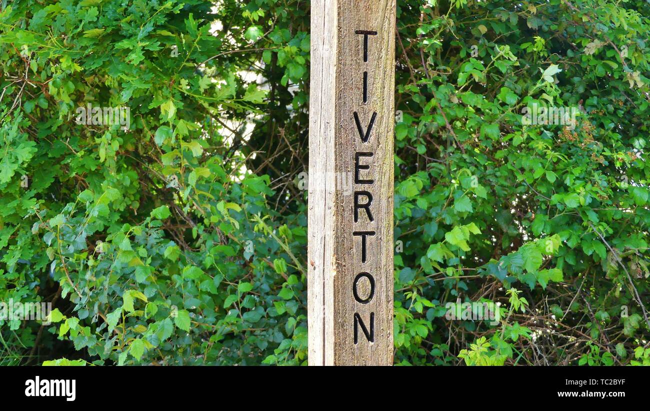 Tiverton, UK - July 1 2019: A wooden signpost along the Grand Union ...