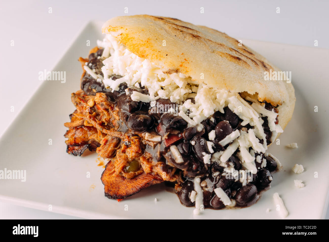 Arepa typical of Venezuela, Pabellon criollo, stuffed with fried ...