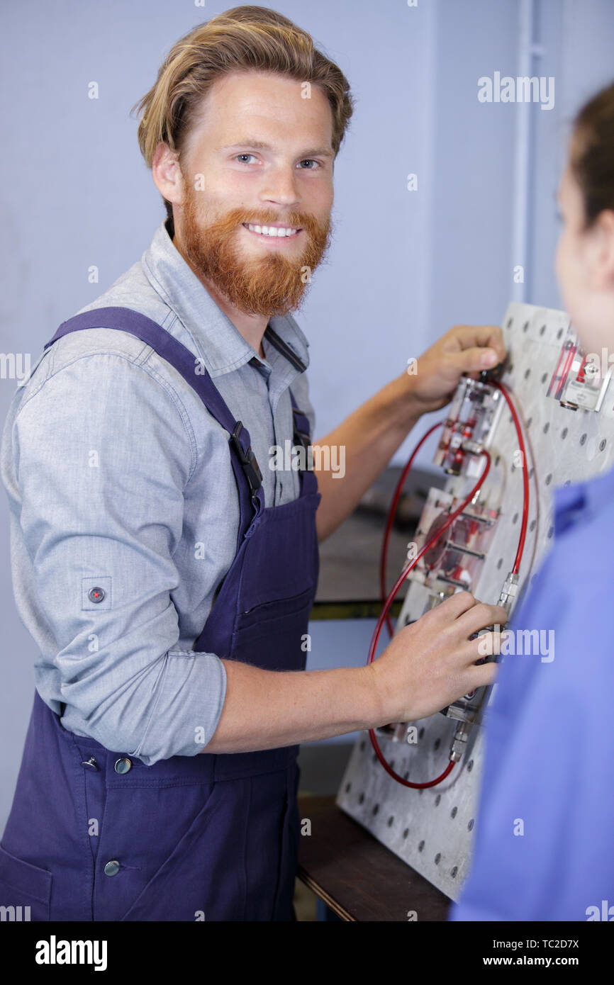 Smiling electrician working wire hi-res stock photography and images ...