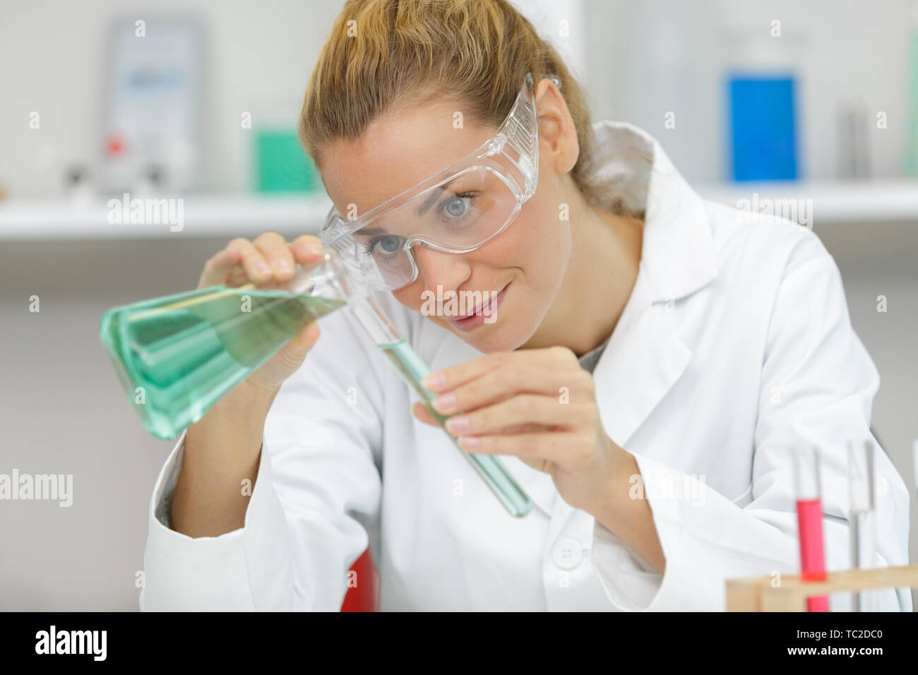 happy female lab worker Stock Photo - Alamy