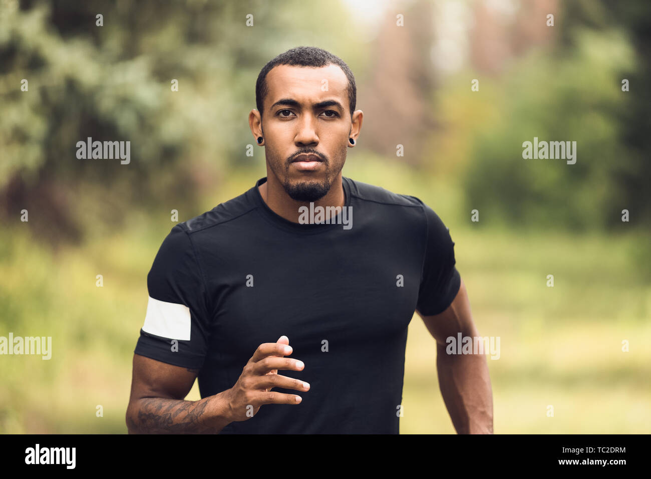 Morning Running. African-American Runner Jogging In Park Stock Photo ...
