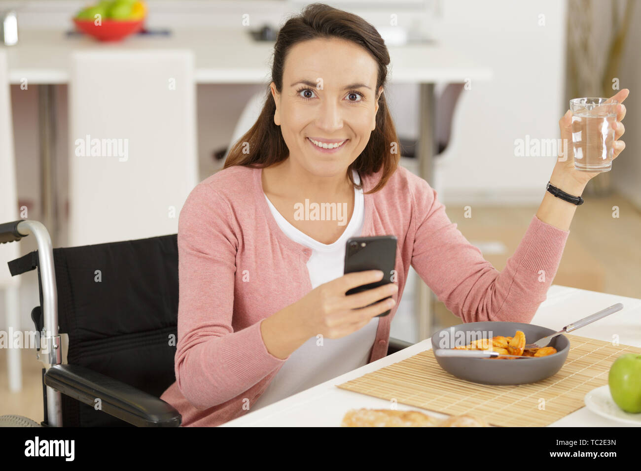 disabled woman eating at home Stock Photo - Alamy