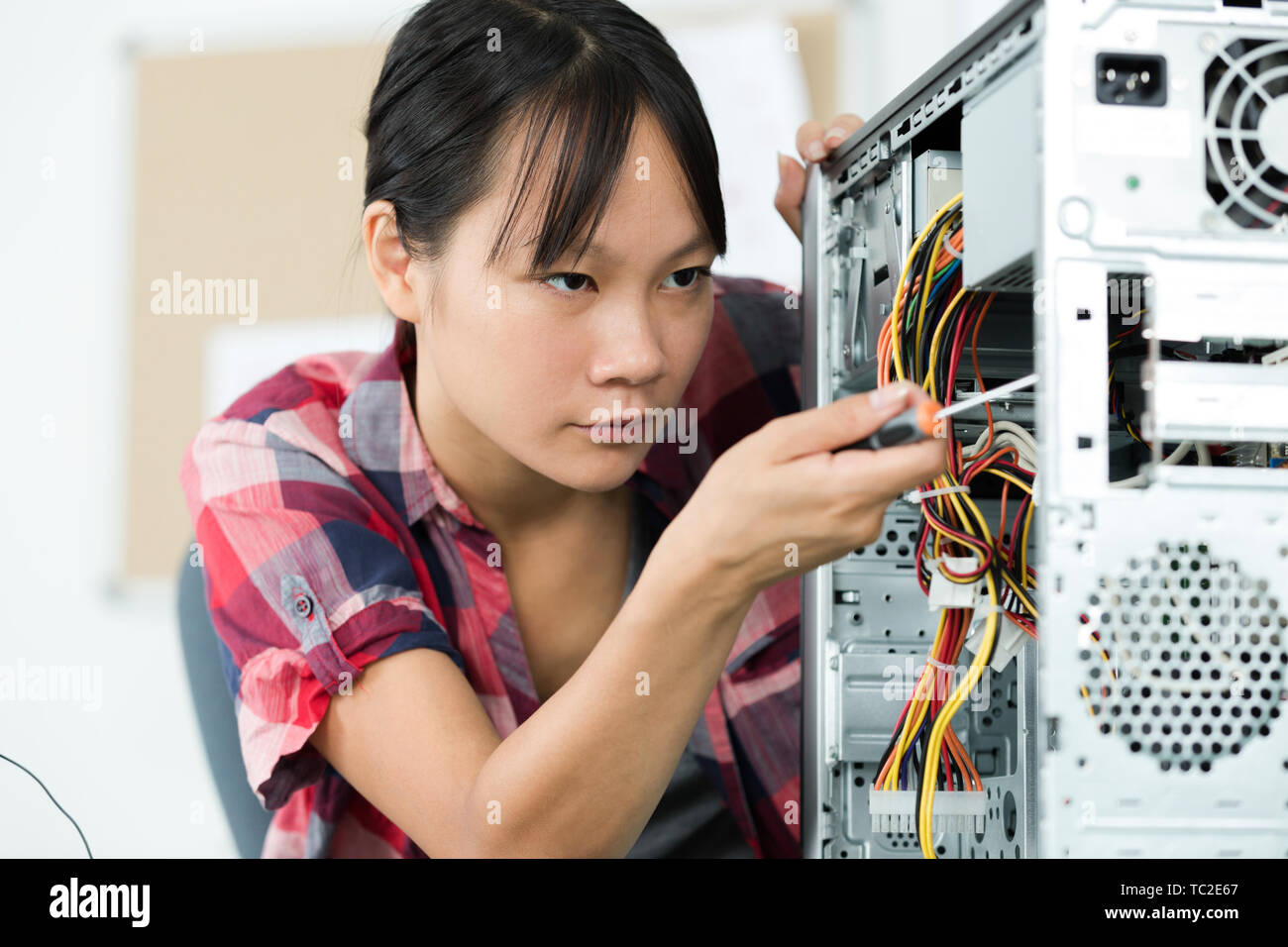 young woman engineer repairing a computer pc Stock Photo - Alamy