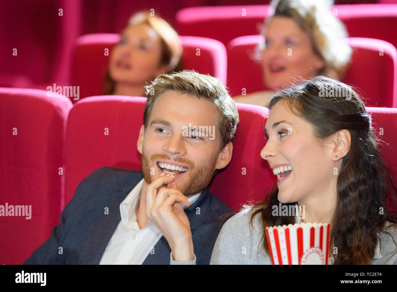 happy couple watching movie in cinema Stock Photo - Alamy