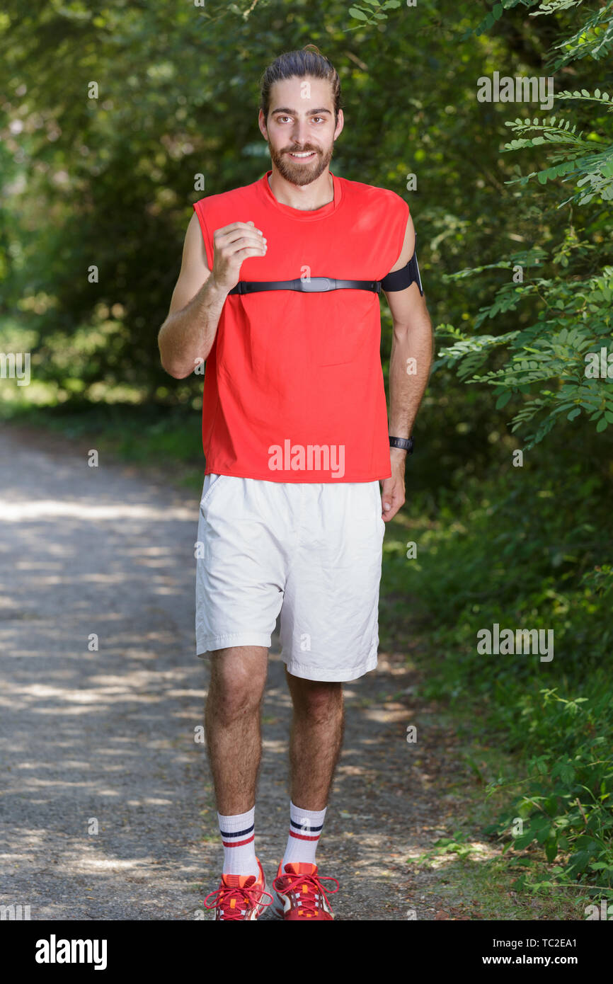 happy man running in park during summer Stock Photo - Alamy