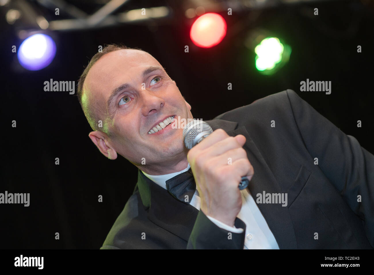 Suited man standing hi-res stock photography and images - Alamy