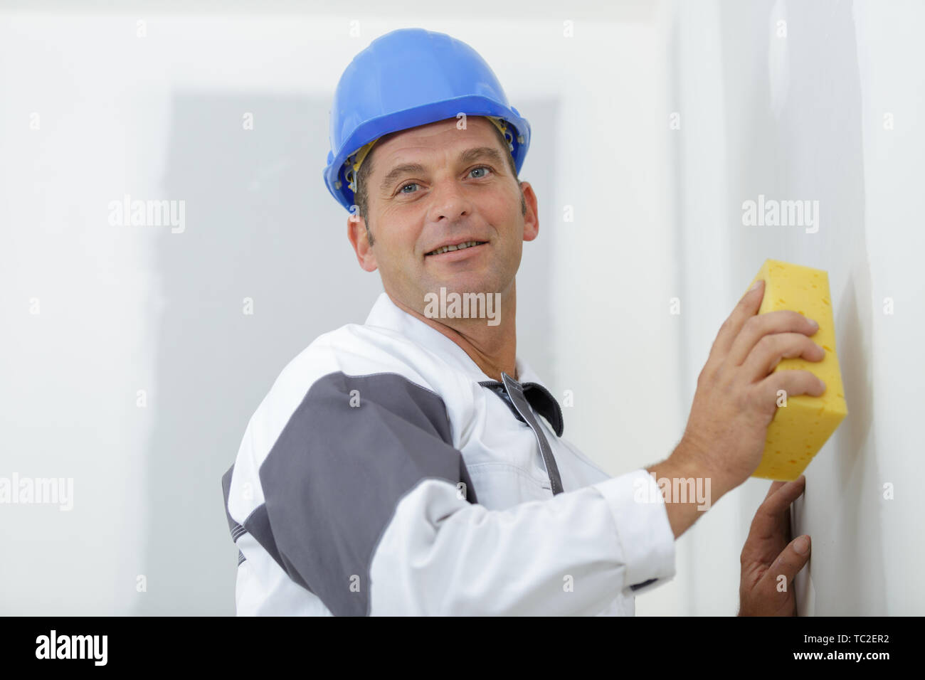worker washing wall Stock Photo - Alamy