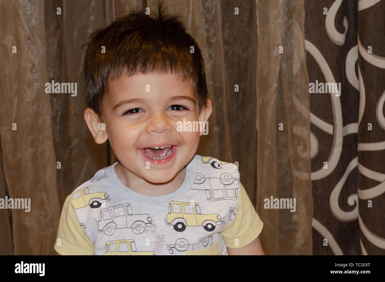 cute two years old boy making funny faces early development concept ...