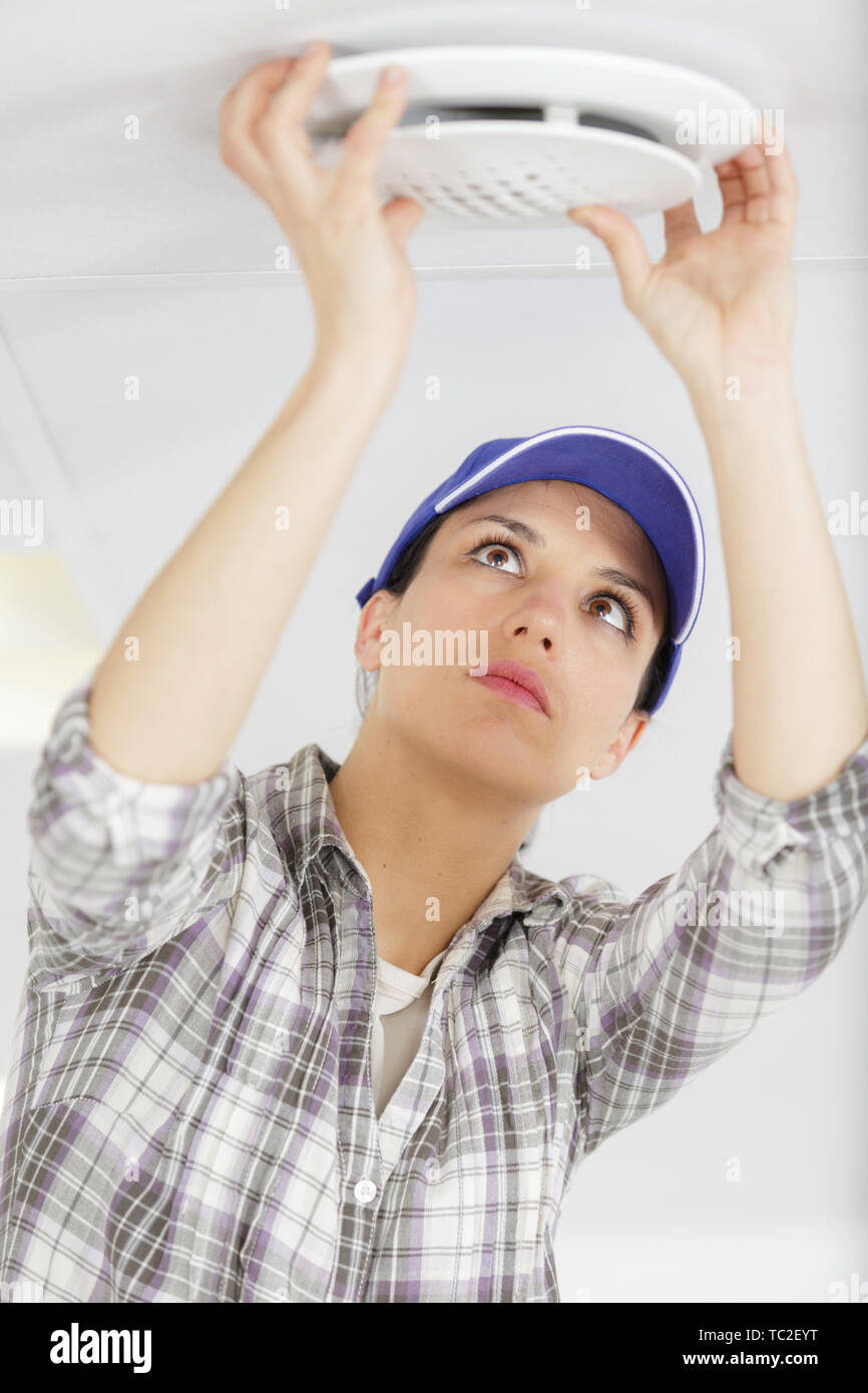 engineer woman checking ceiling air ventilation system Stock Photo - Alamy