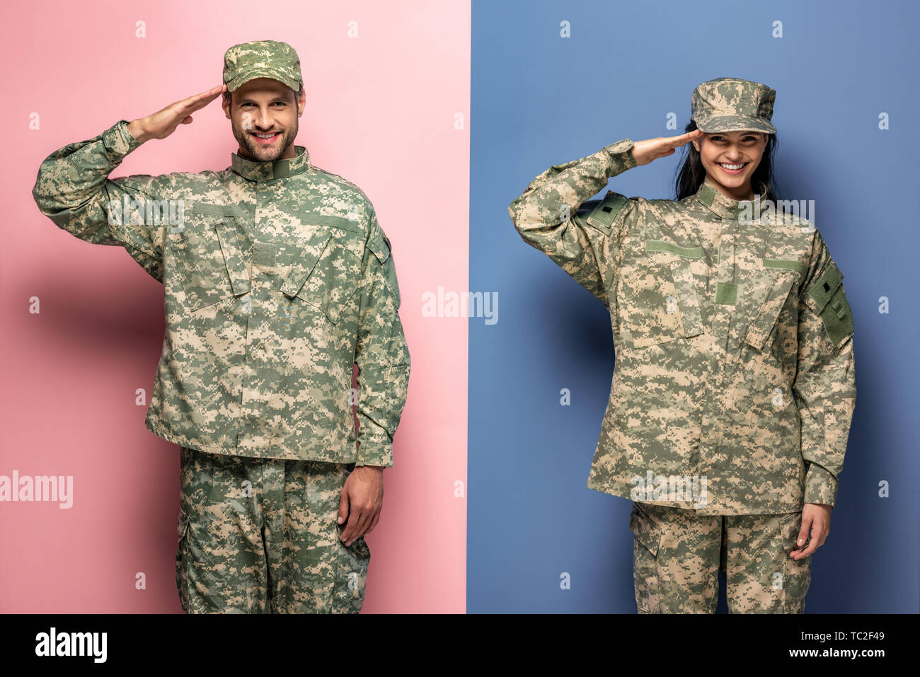 man and woman in military uniform saluting on blue and pink Stock Photo ...
