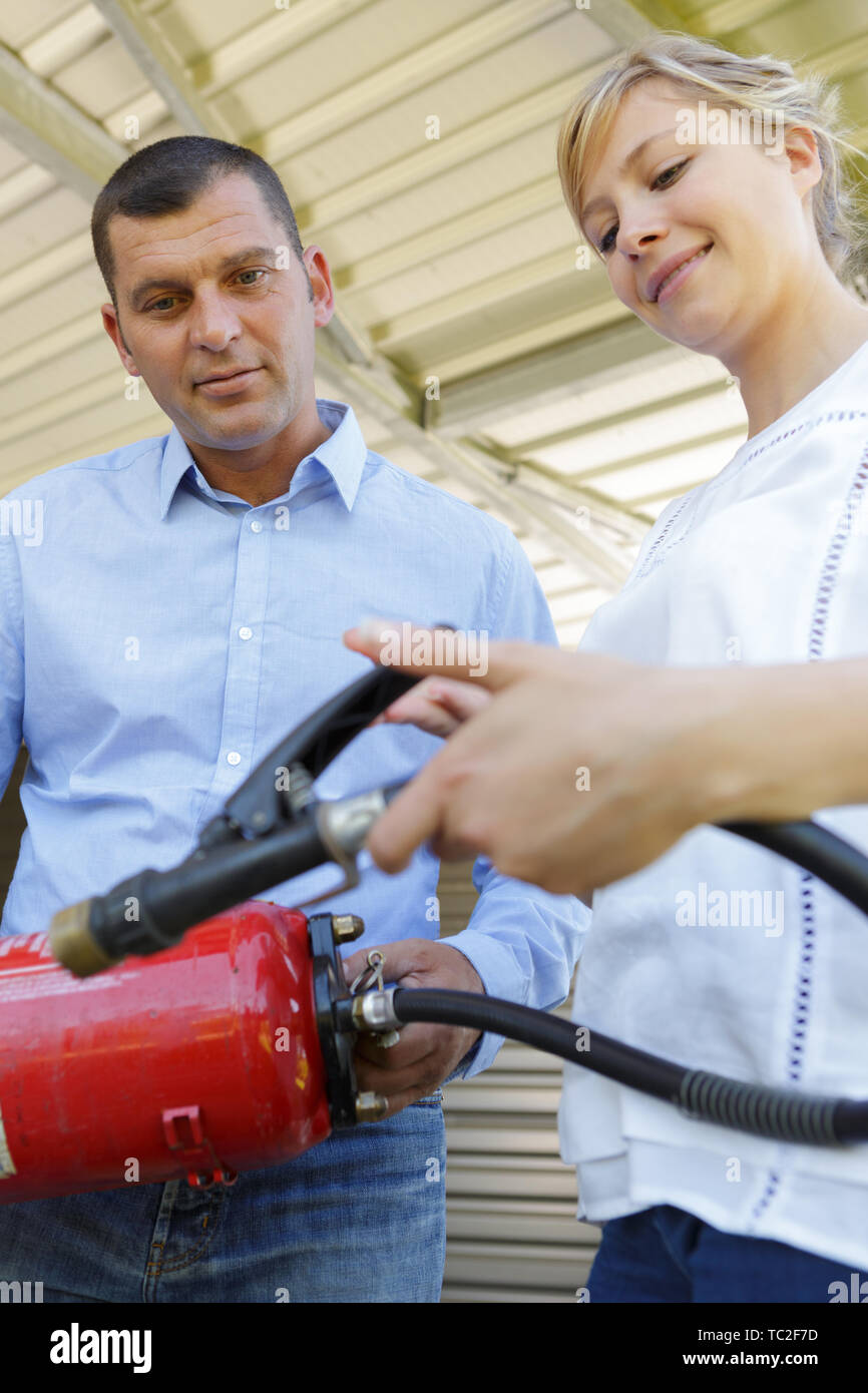 workers with fire extinguisher Stock Photo - Alamy