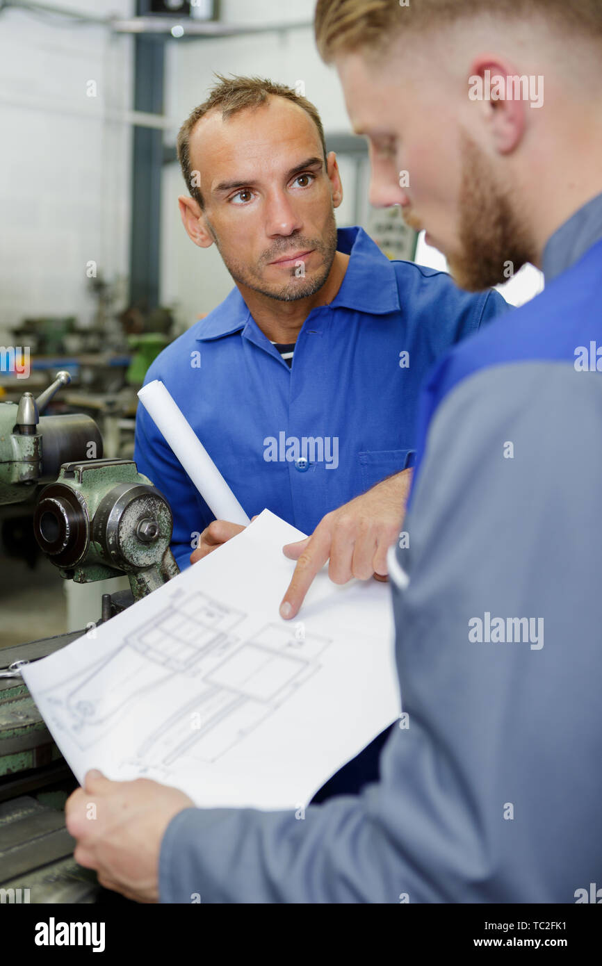 production man worker and colleague in factory Stock Photo - Alamy
