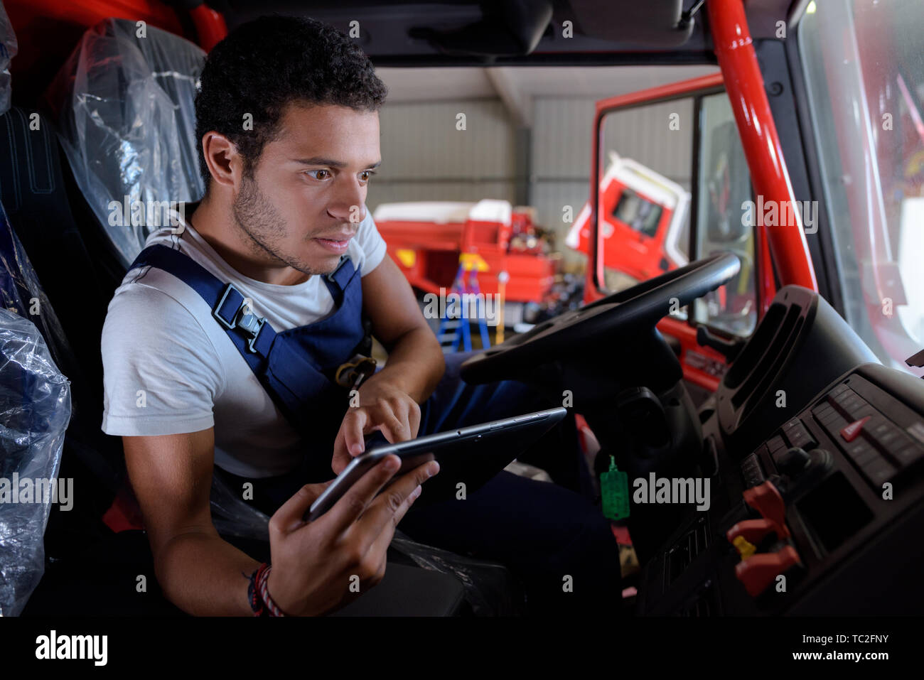 firetruck mechanic at work Stock Photo - Alamy