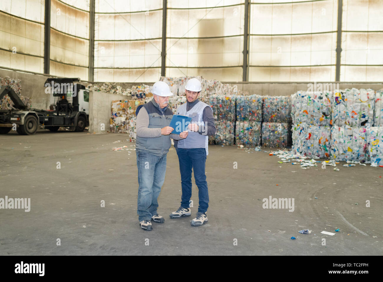 workers on recycling plant Stock Photo - Alamy