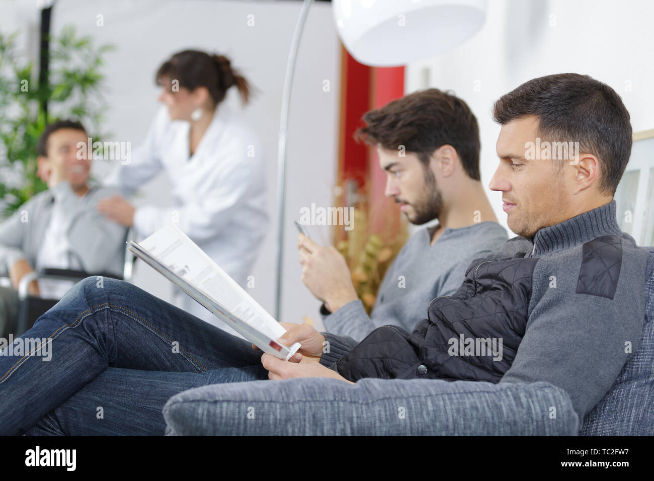 men on waiting room Stock Photo - Alamy