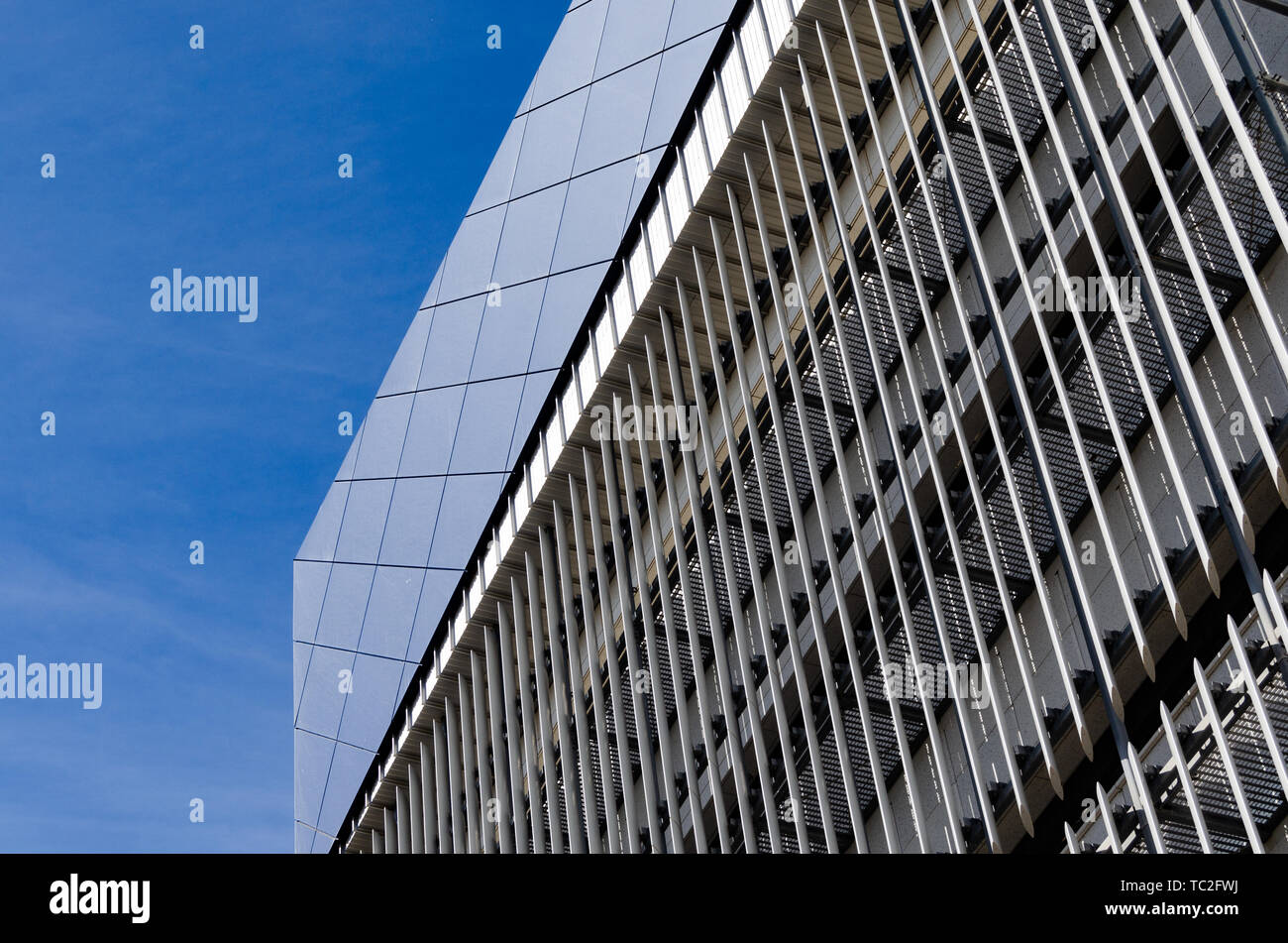 Bright Blue City Buildings With Clouds Stock Photo - Alamy