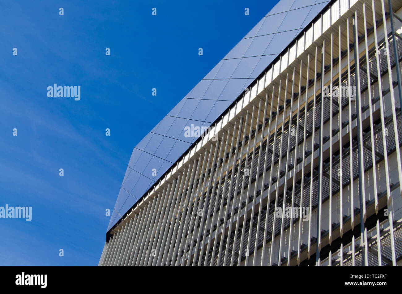 Bright Blue City Buildings With Clouds Stock Photo - Alamy