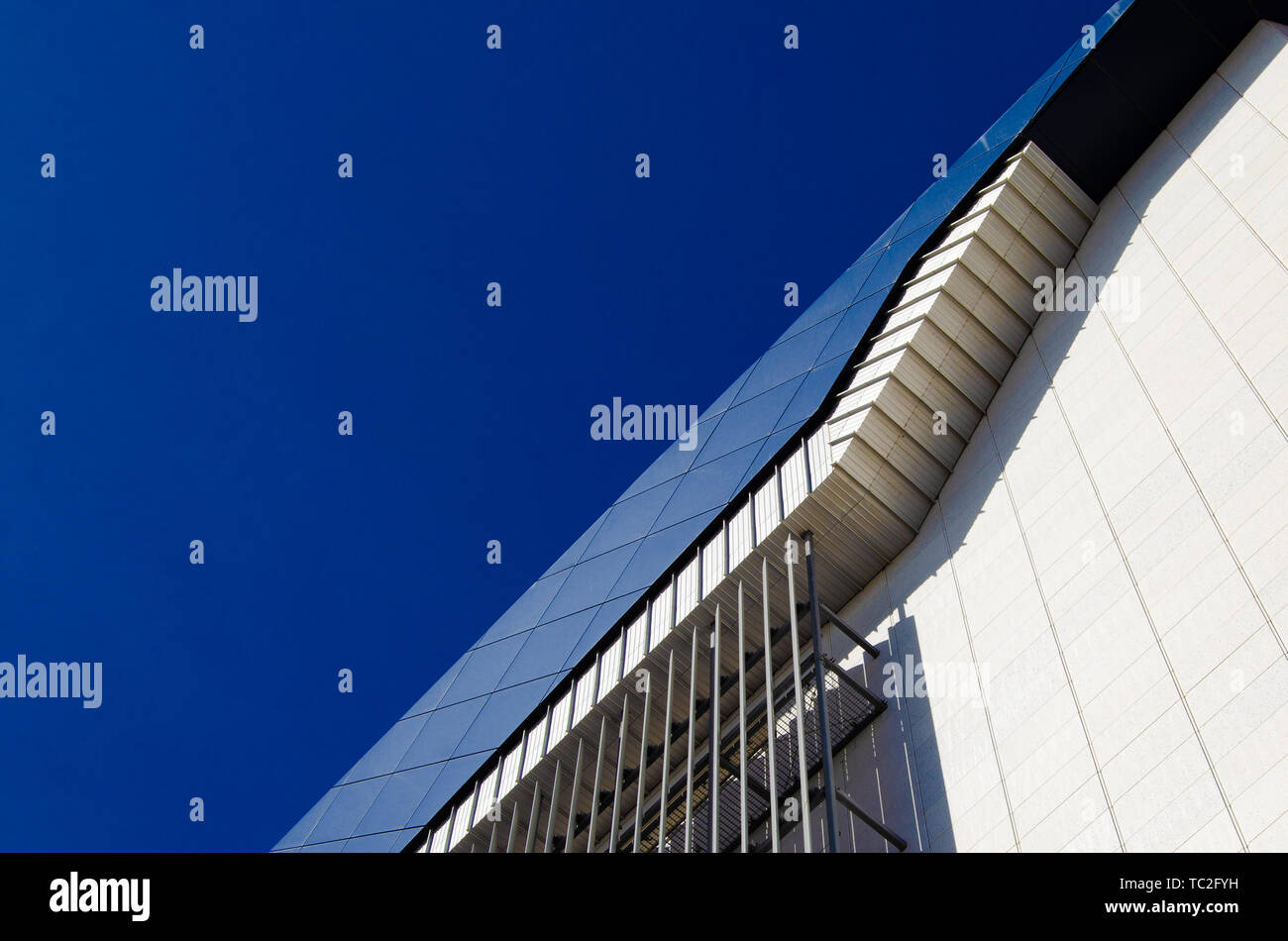 Bright Blue City Buildings With Clouds Stock Photo - Alamy