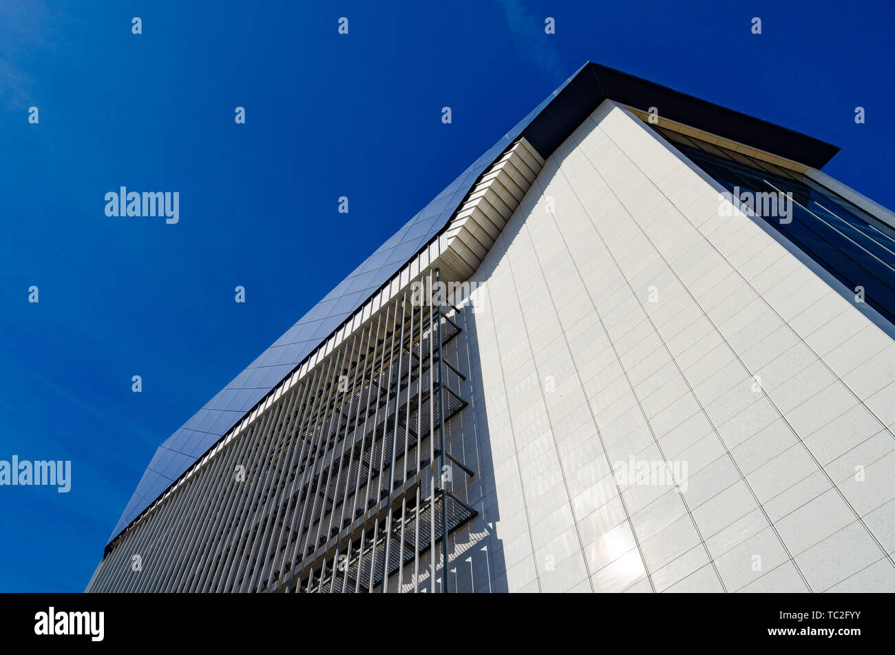 Bright Blue City Buildings With Clouds Stock Photo - Alamy