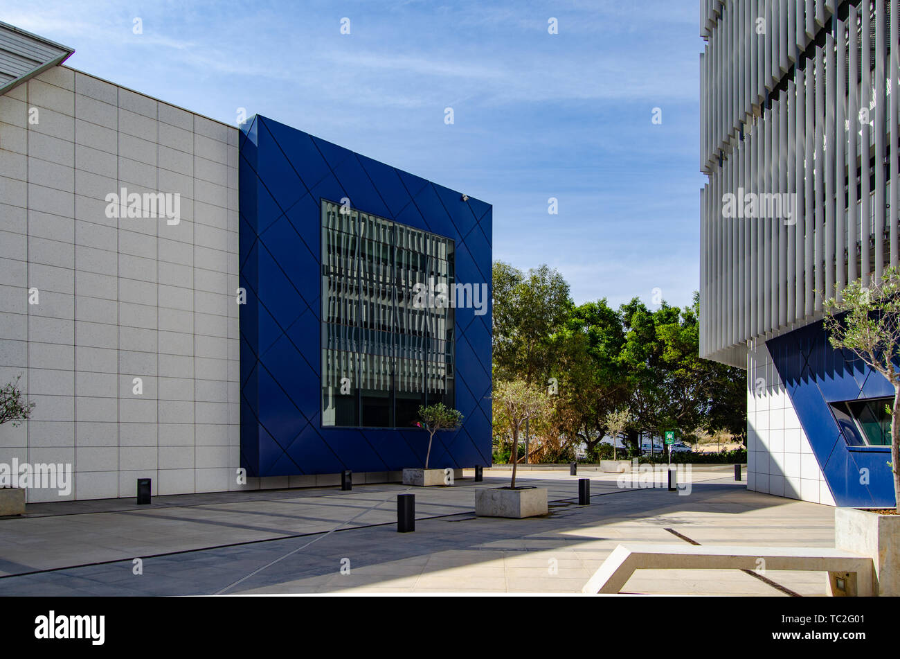 Bright Blue City Buildings With Clouds Stock Photo - Alamy