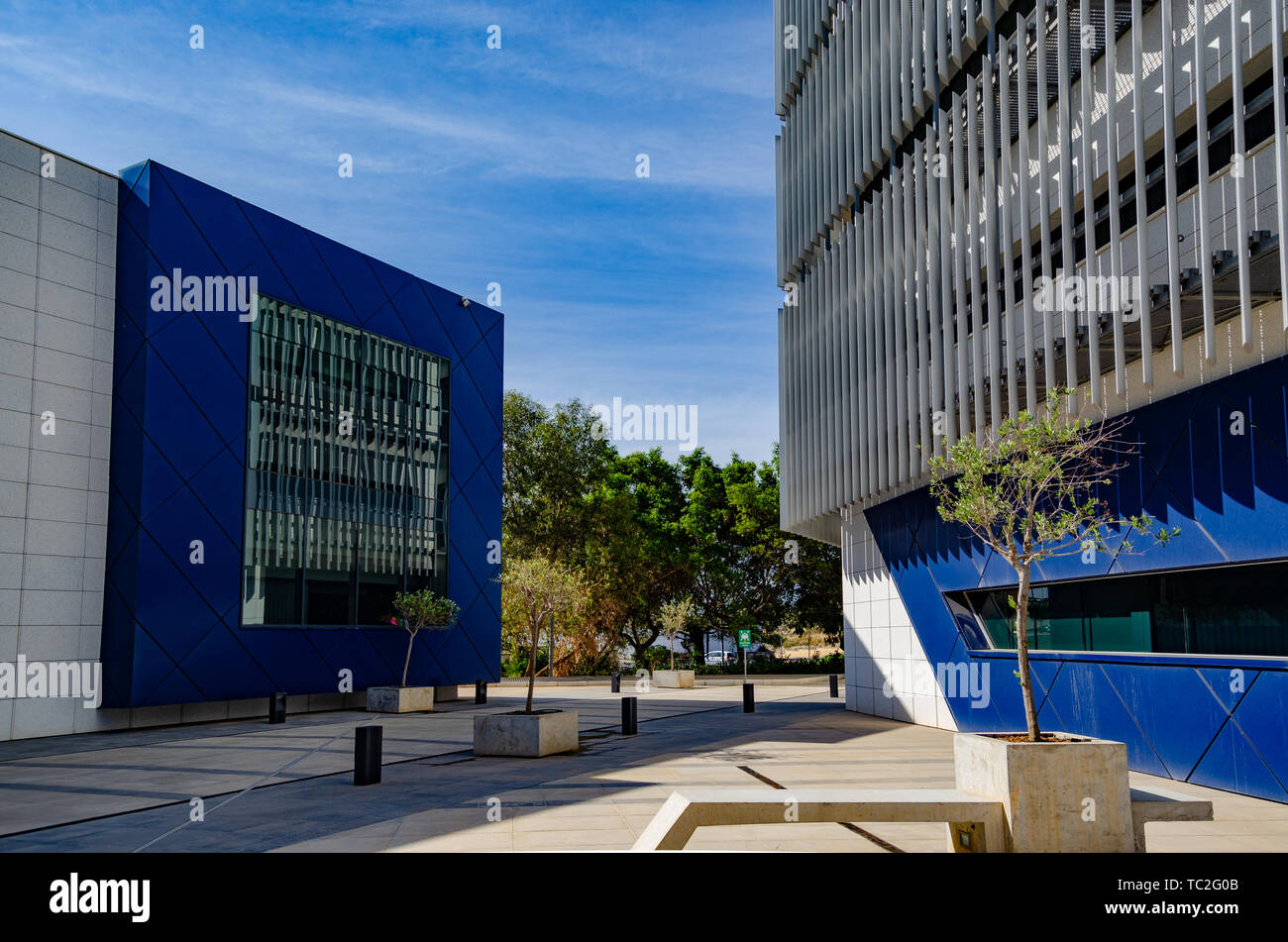 Bright Blue City Buildings With Clouds Stock Photo - Alamy