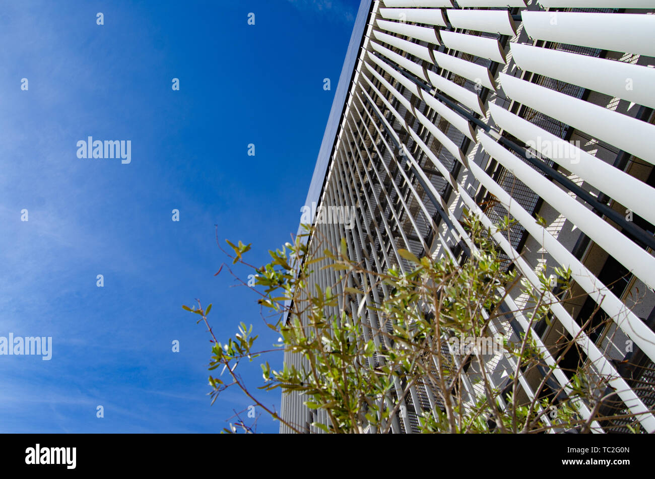 Bright Blue City Buildings With Clouds Stock Photo - Alamy