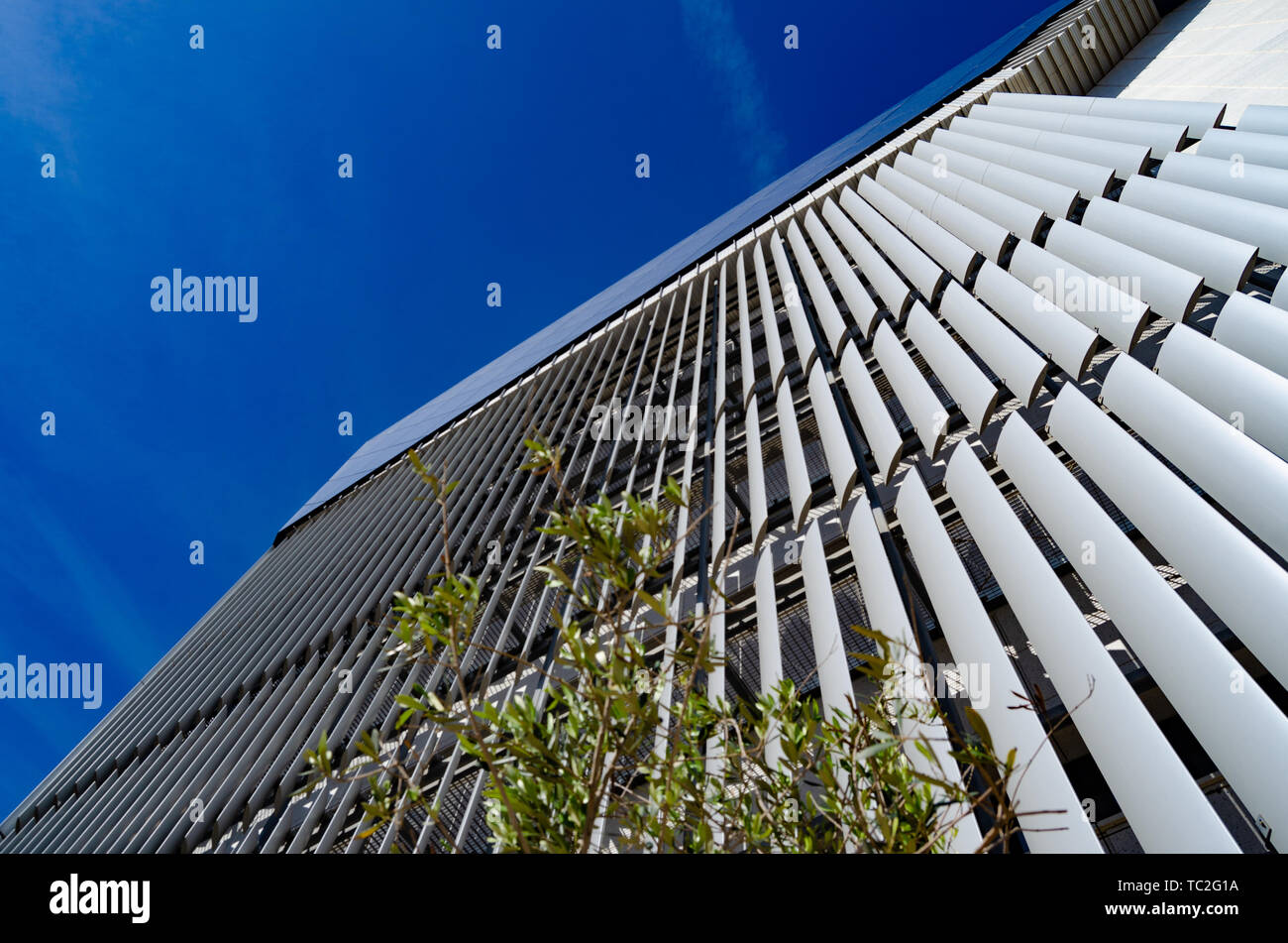 Bright Blue City Buildings With Clouds Stock Photo - Alamy