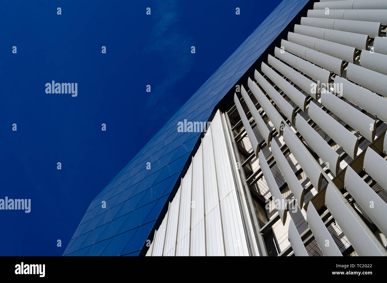 Bright Blue City Buildings With Clouds Stock Photo - Alamy