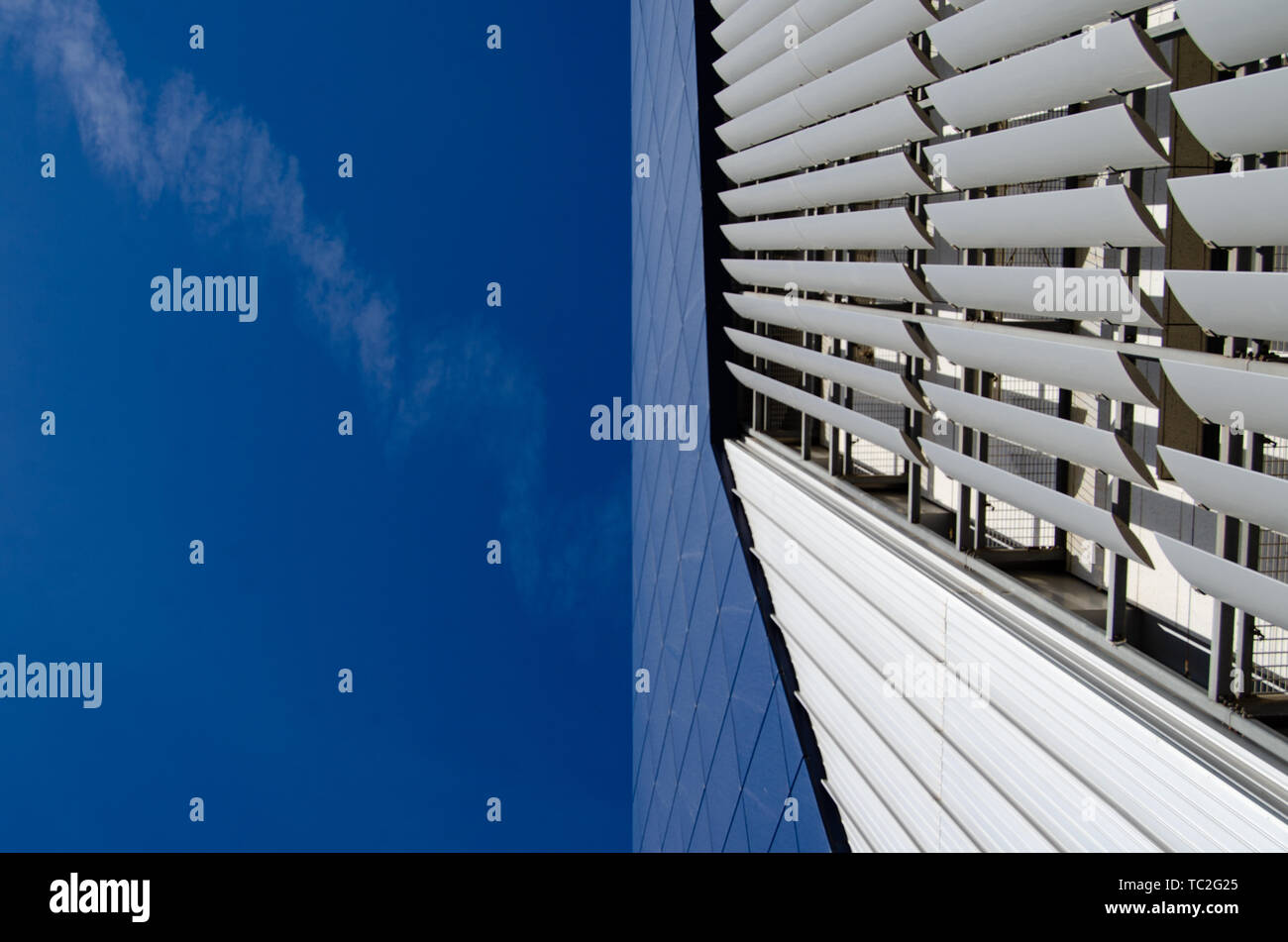 Bright Blue City Buildings With Clouds Stock Photo - Alamy