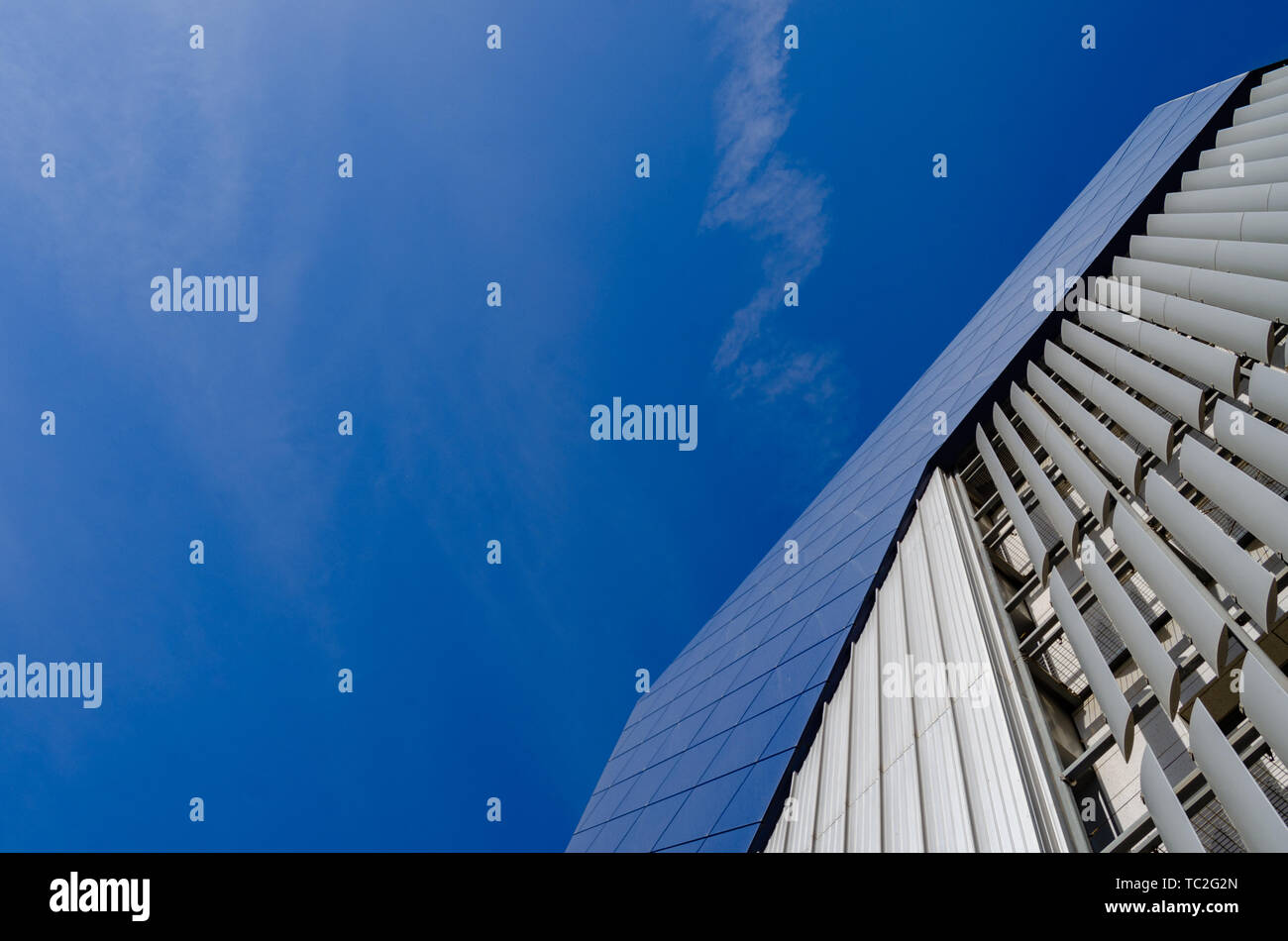 Bright Blue City Buildings With Clouds Stock Photo - Alamy