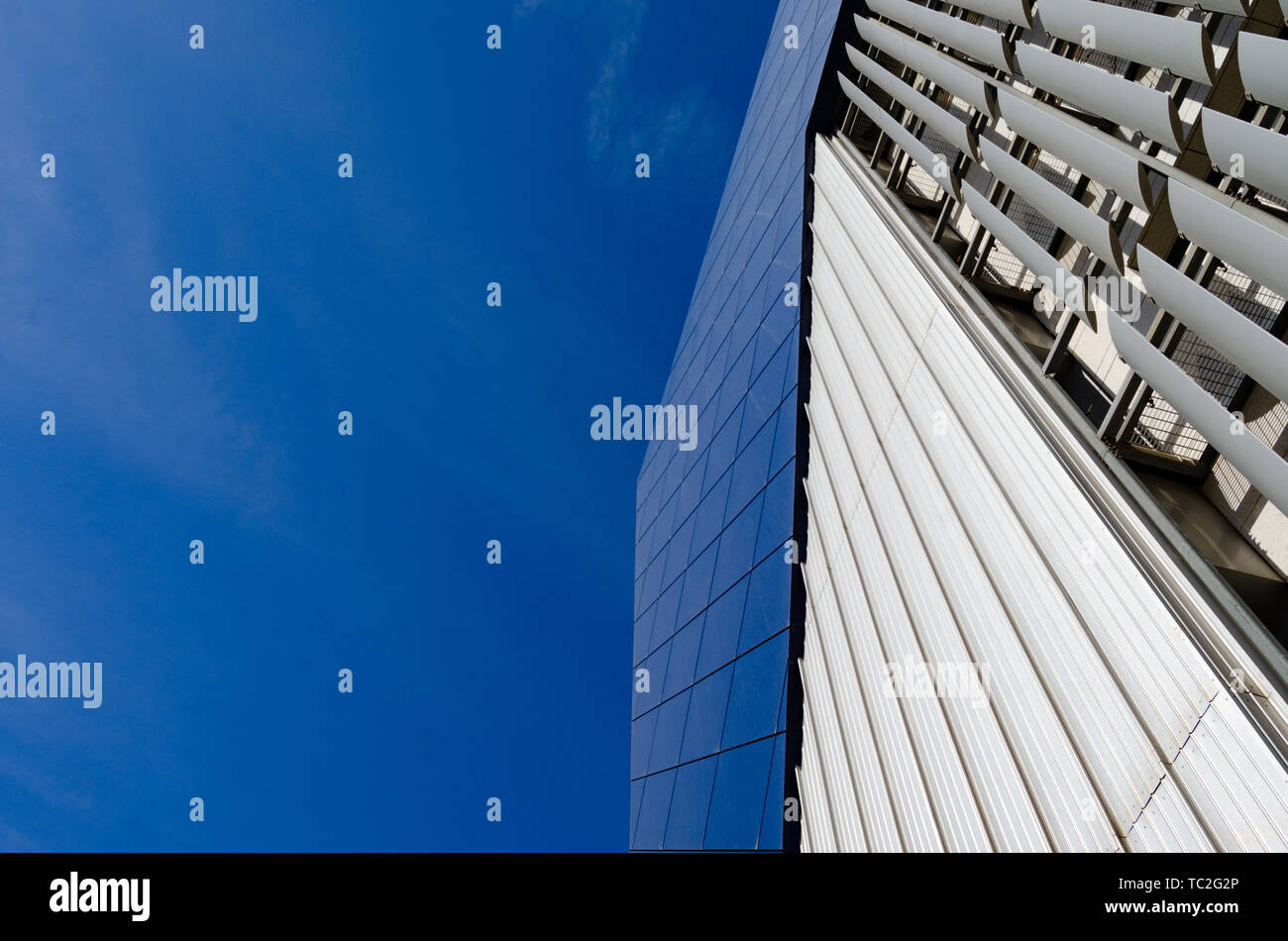 Bright Blue City Buildings With Clouds Stock Photo - Alamy