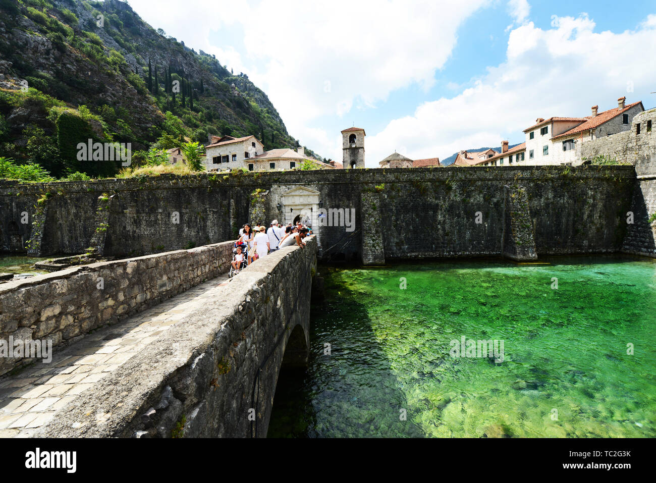 Tourist crossing the bridge near Vrata od Škurde in the old town of ...