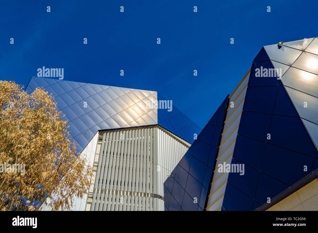 Bright Blue City Buildings With Clouds Stock Photo - Alamy