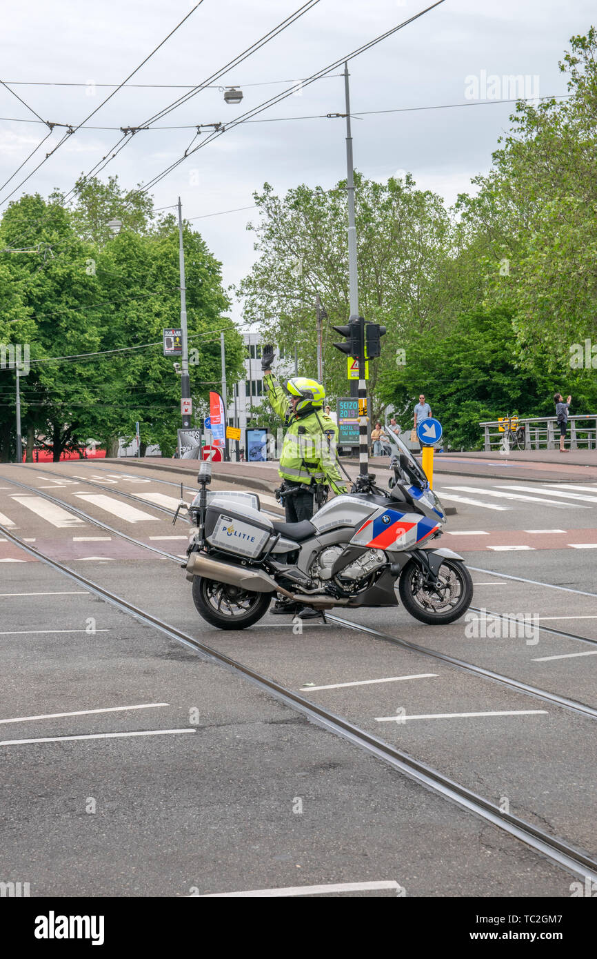 Motor Policeman Regulating Traffic At Amsterdam The Netherlands 2019 ...
