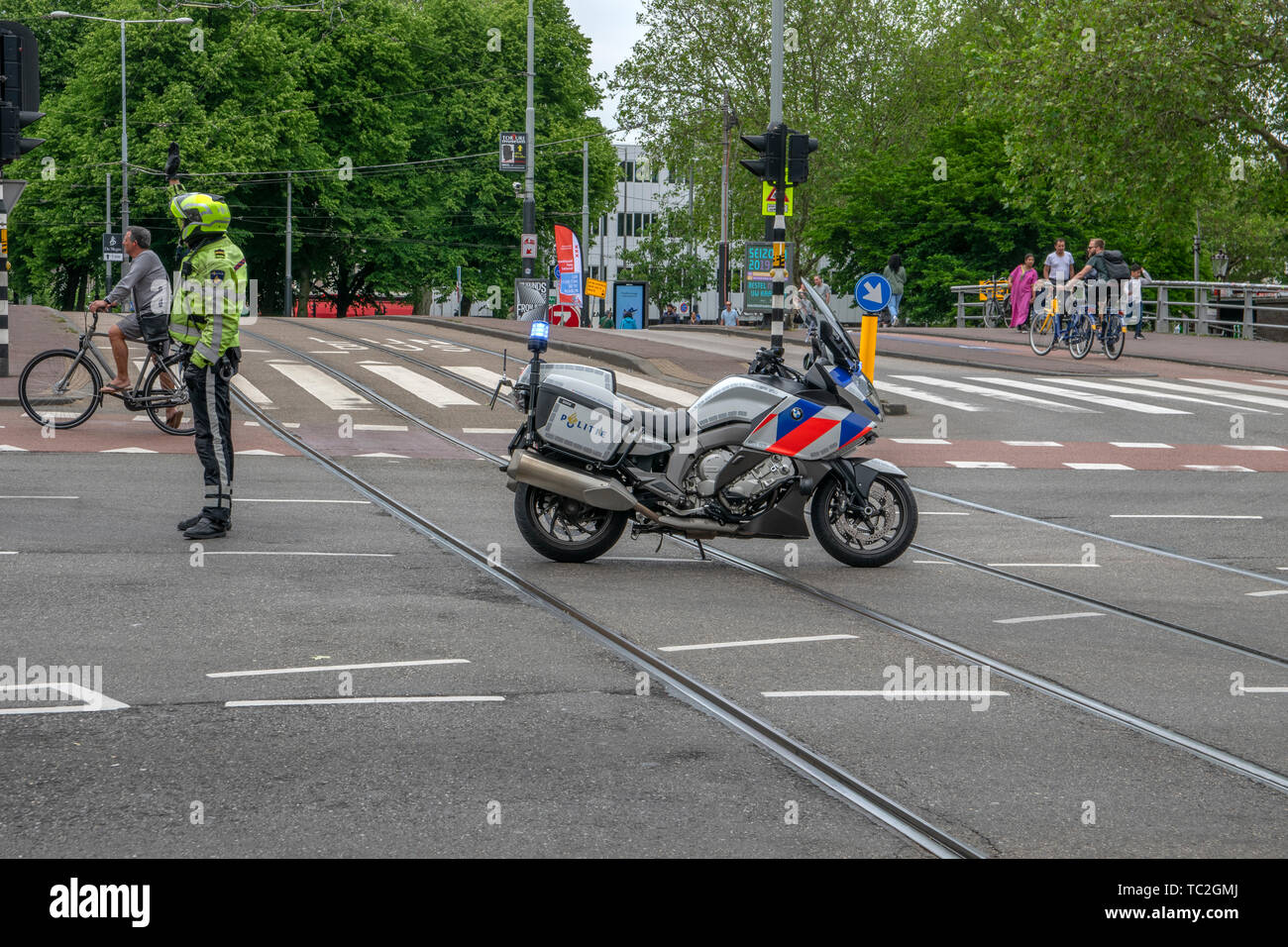 Motor Policeman Regulating Traffic At Amsterdam The Netherlands 2019 ...