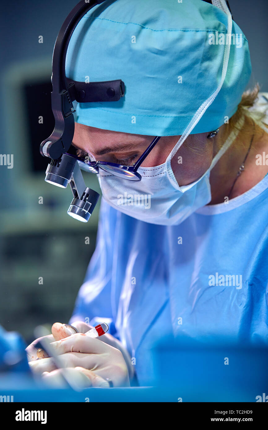 Close up portrait of female surgeon doctor wearing protective mask and ...
