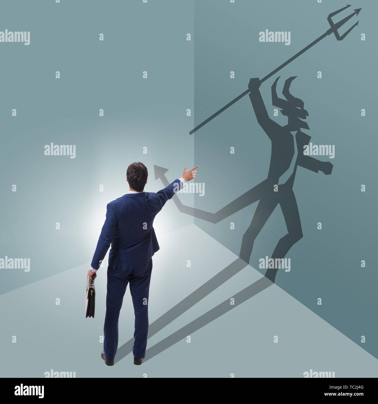 Devil hiding in the businessman - alter ego concept Stock Photo - Alamy