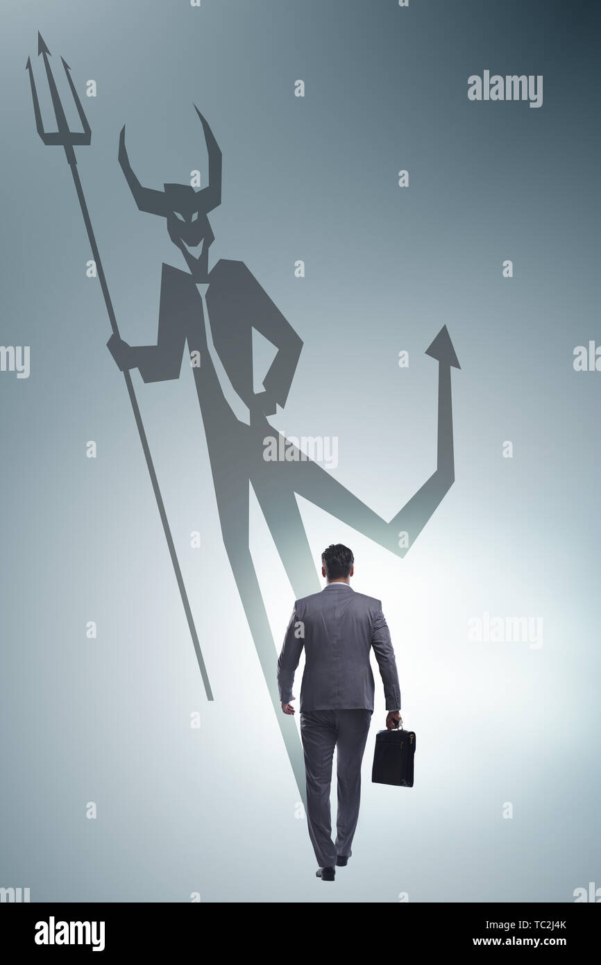 Devil hiding in the businessman - alter ego concept Stock Photo - Alamy